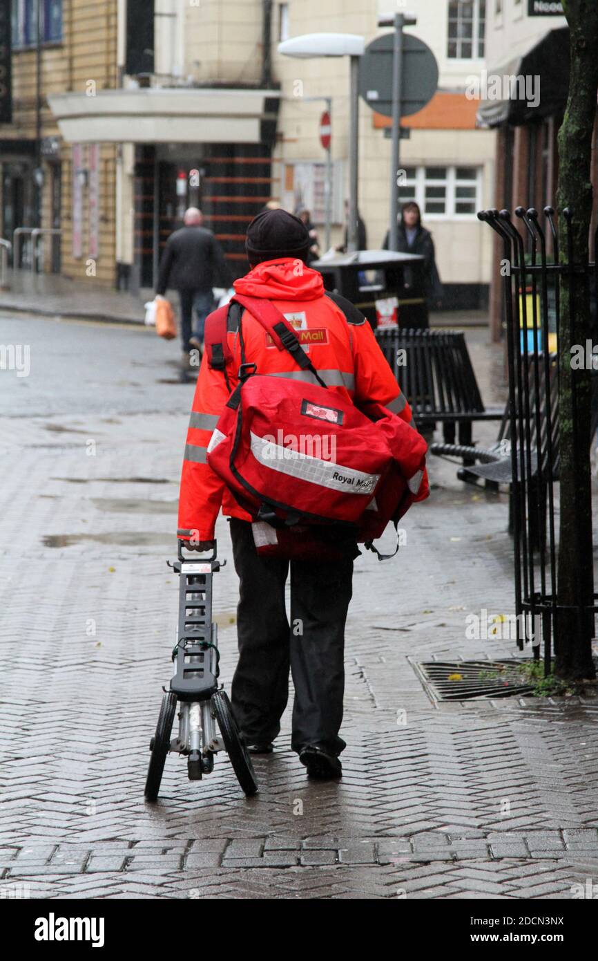 Postman walking away hi-res stock photography and images - Alamy