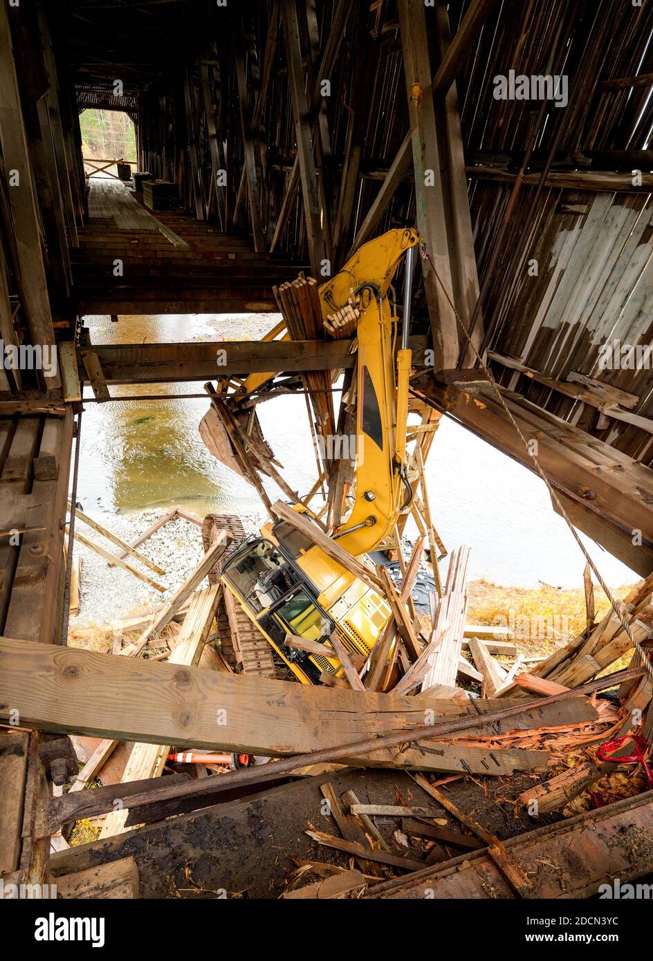 Large construction equipment crashed through the bottom of a wooden ...