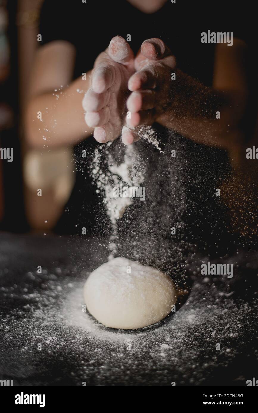 flour and dough in hands of a person Stock Photo - Alamy