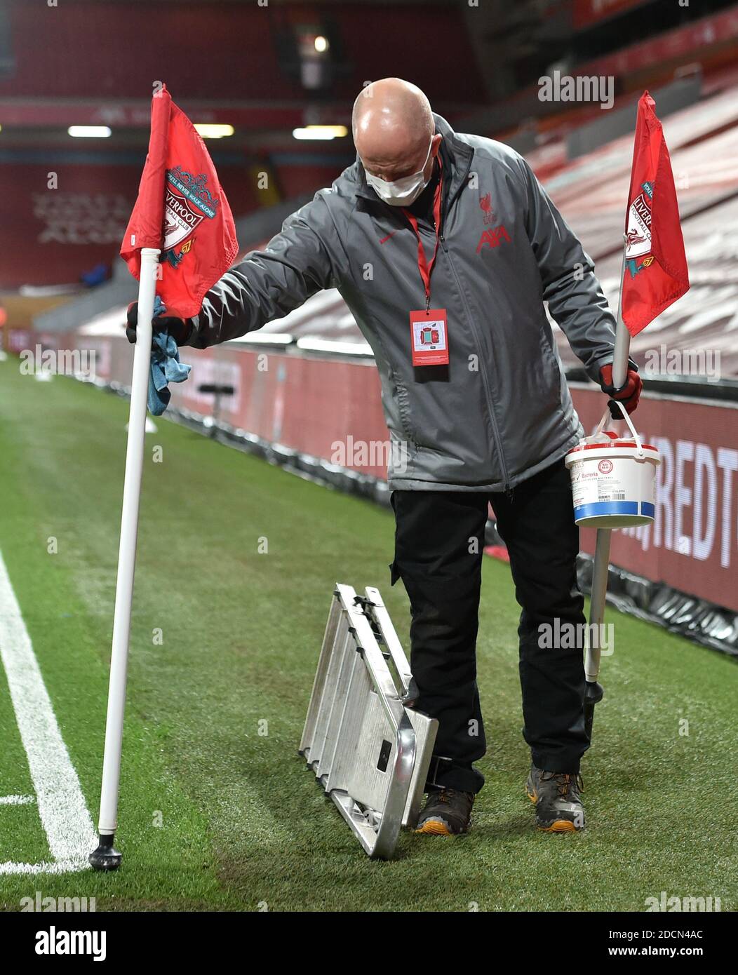 A steward puts the corner flags into position before the Premier League ...