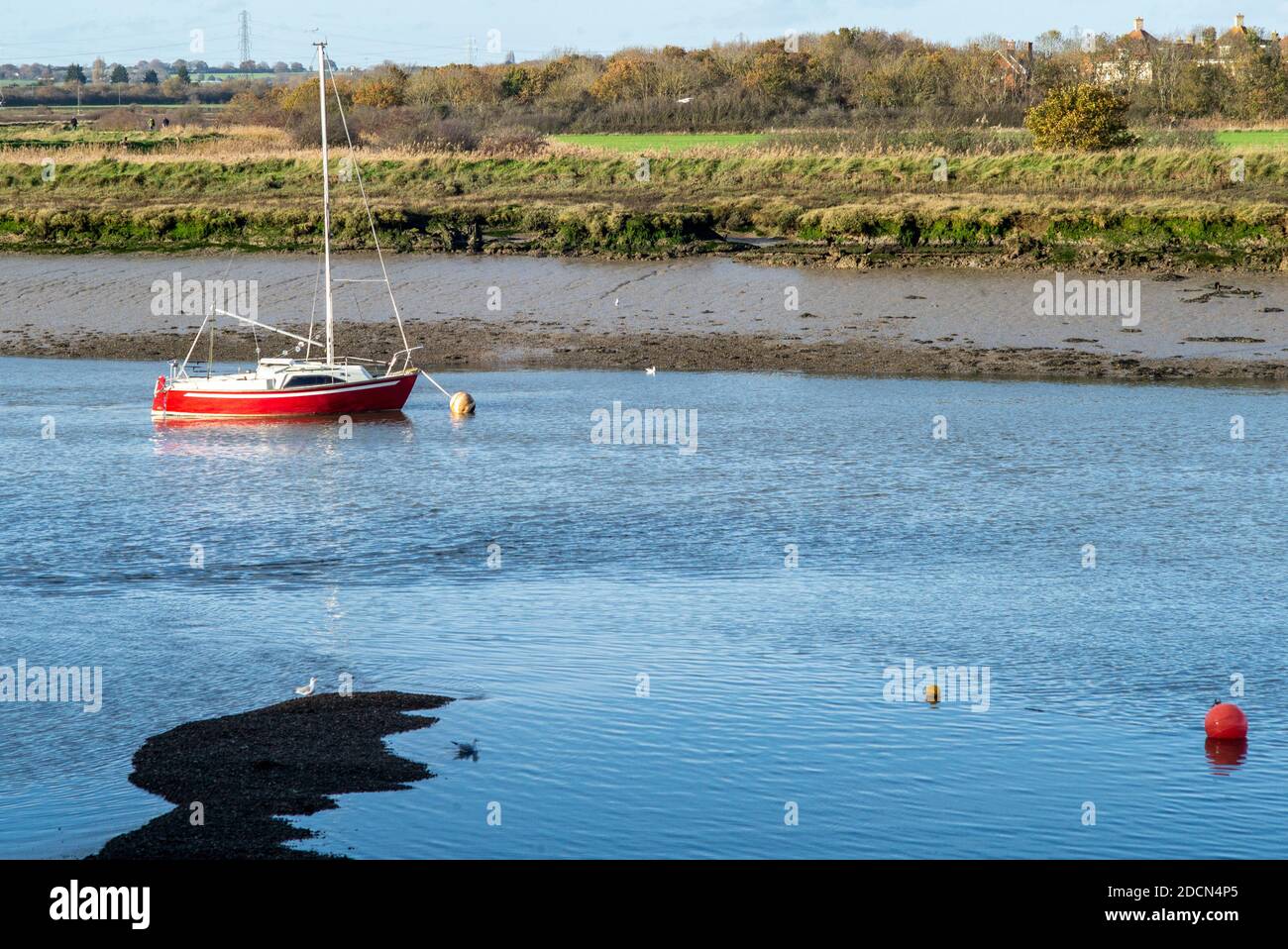 Lone yacht at low tide in Hullbridge on the River Crouch Stock Photo ...