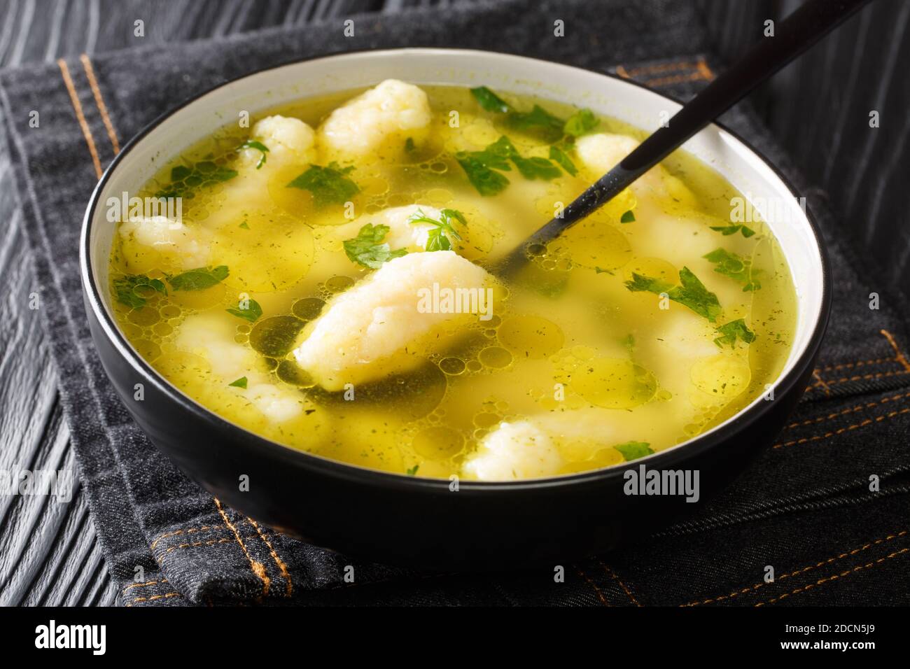 Traditional German Semolina Dumplings Soup close-up in a plate on the ...