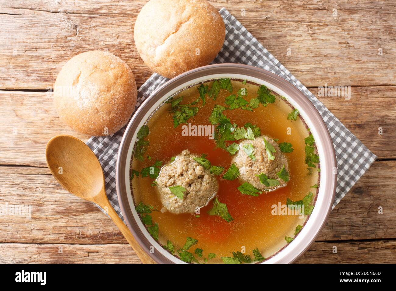 Homemade German broth with liver dumplings close-up in a plate on the ...
