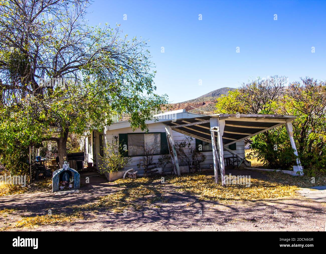 Abandoned Home With Blocked Out Windows & Collapsed Carport Stock Photo ...