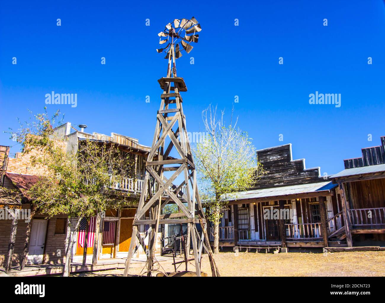 Old Weather Vane & Buildings With Hanging American Flags Stock Photo ...