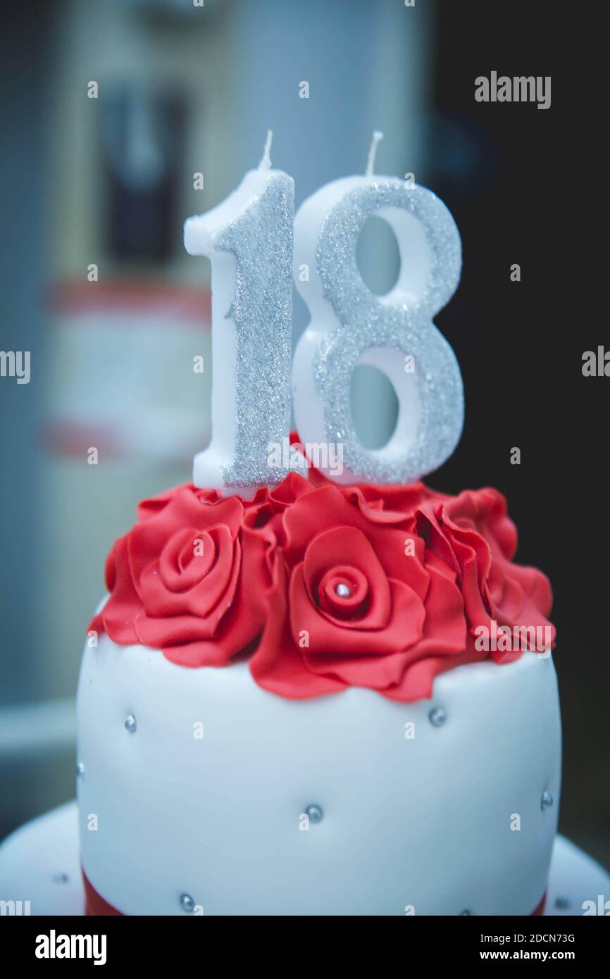 a vertical shot of eighteen number on top of a white hat covered with ...