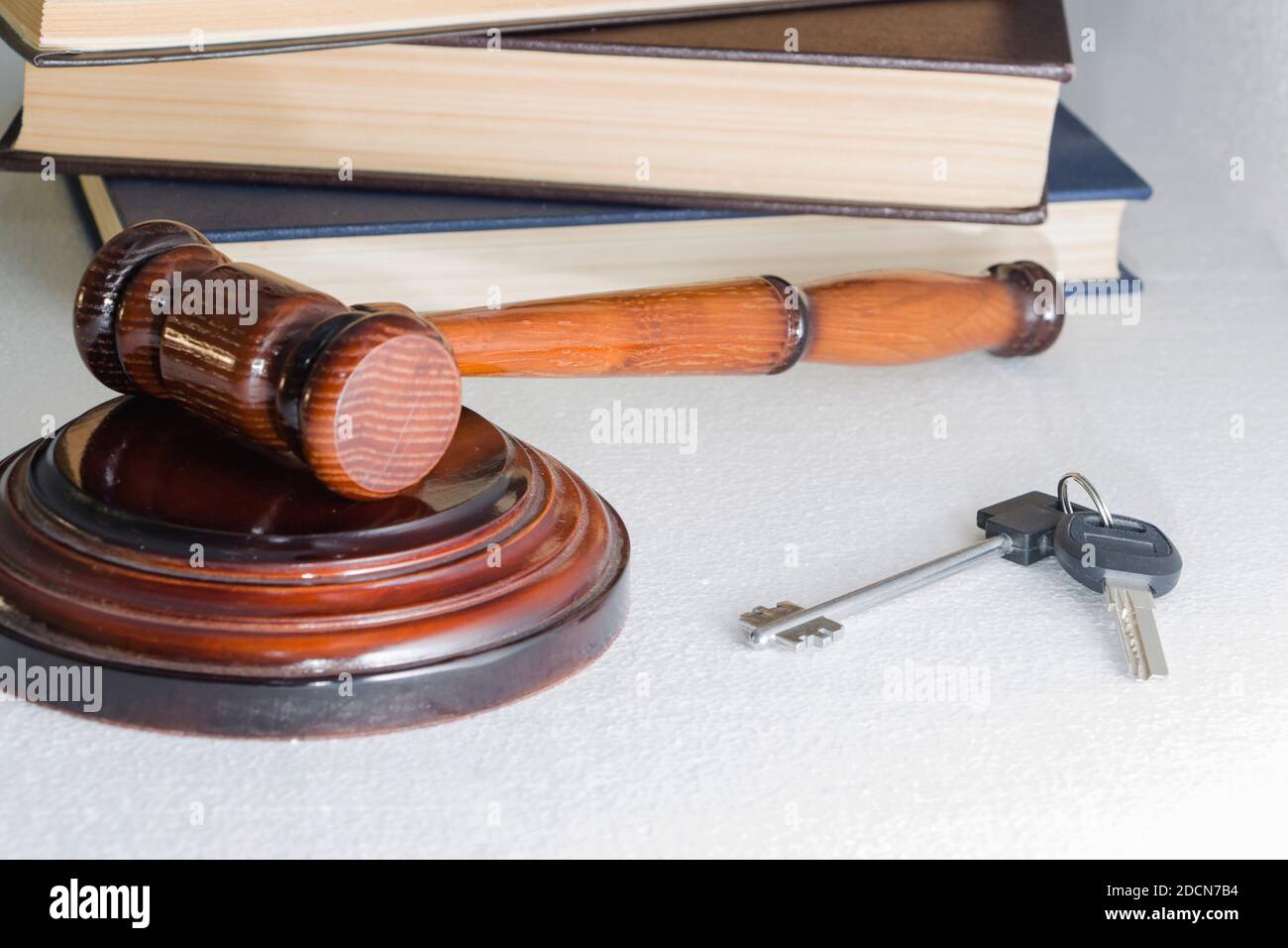 Judge hammer and house key on light background. The concept of property ...