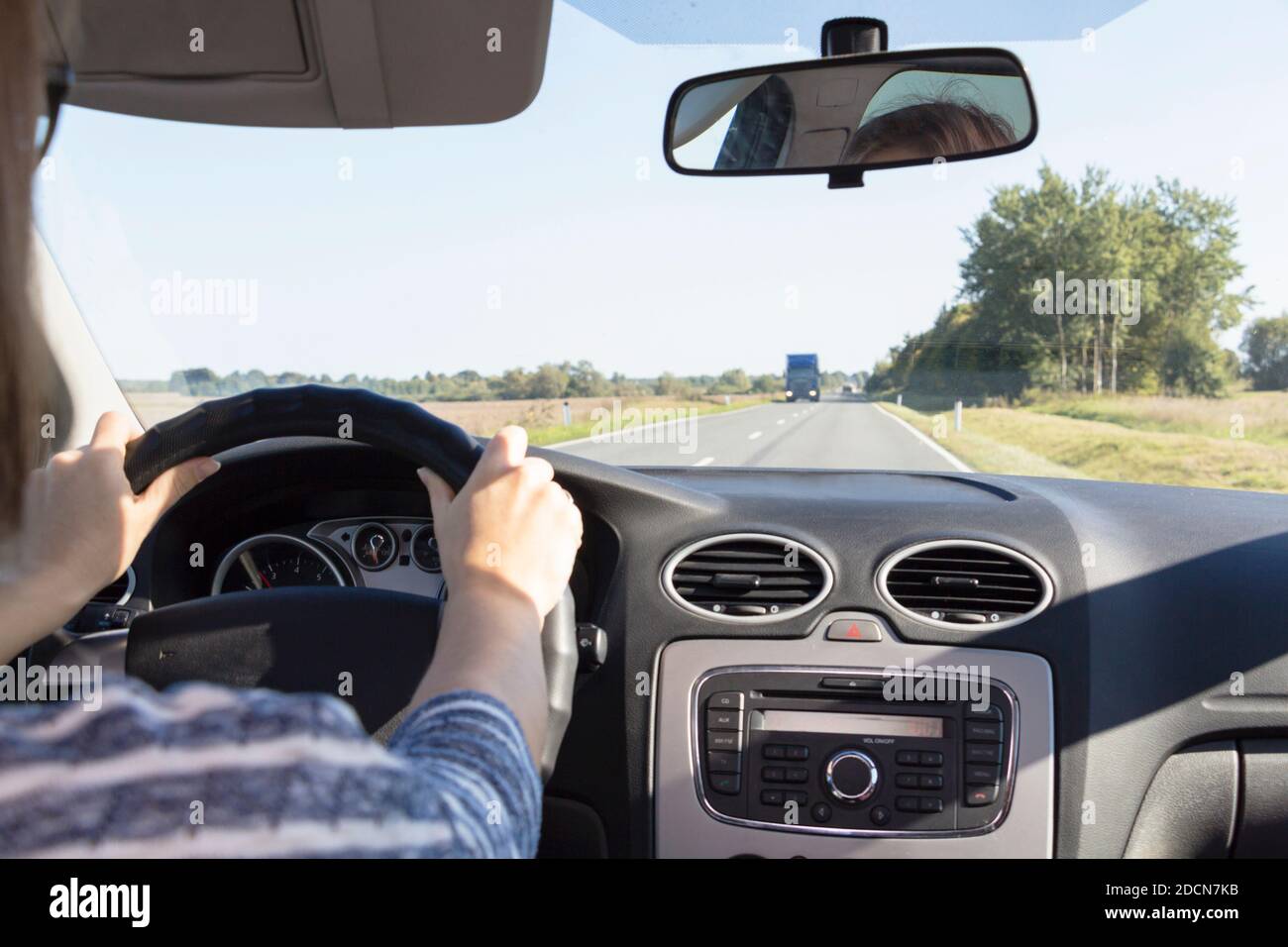 Girl behind steering wheel hi-res stock photography and images - Alamy