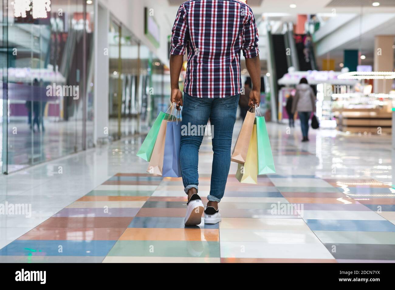 Sale And Consumerism Concept. Unrecognizable Black Man Walking In Mall ...