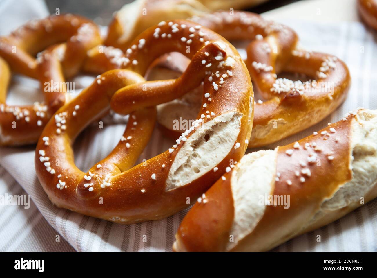 Closeup photo of lye roll bun and bavarian pretzel in bakery Stock ...