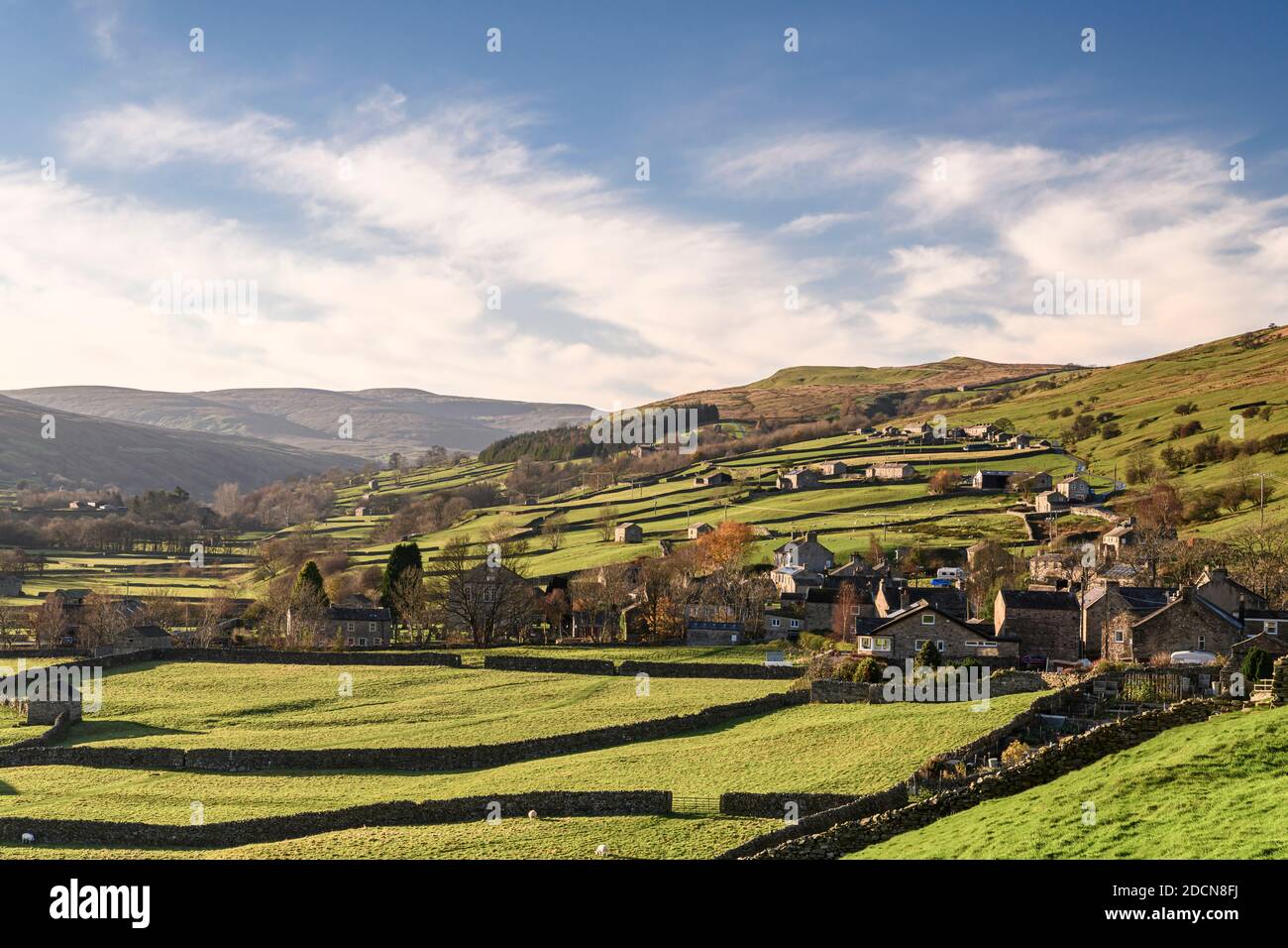 A HDR of Gunnerside and surrounding pasture in winter sunshine ...