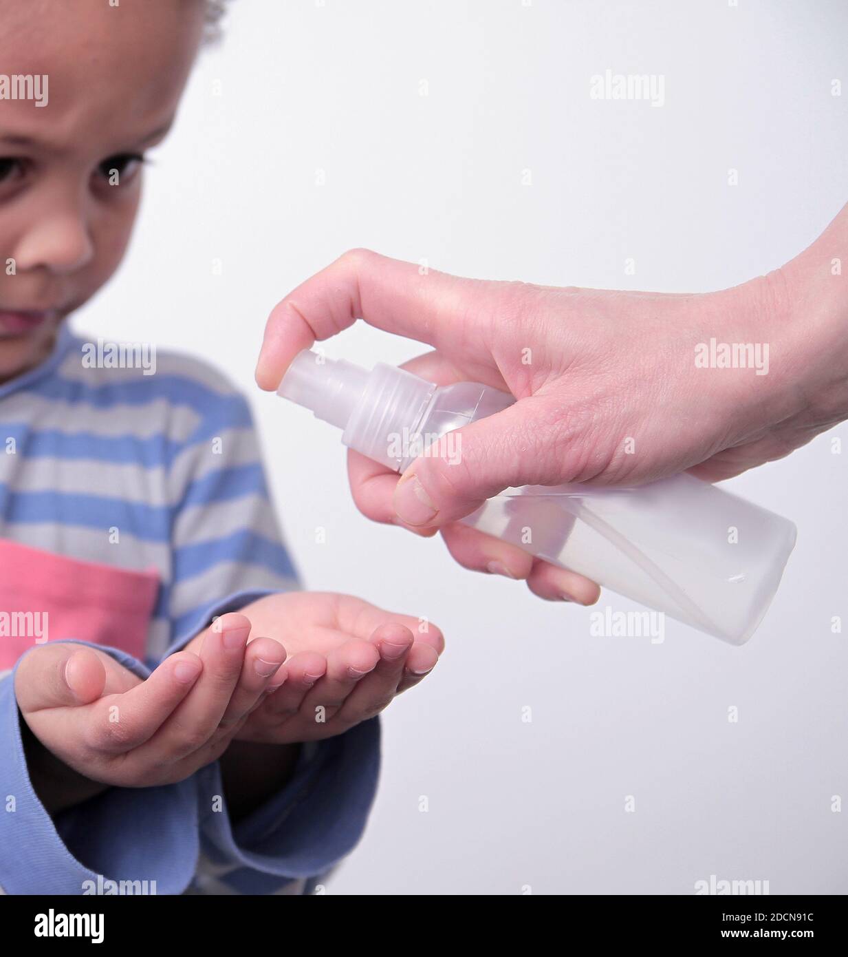 boy hand been sprayed with spray bottle preventing coronavirus ...