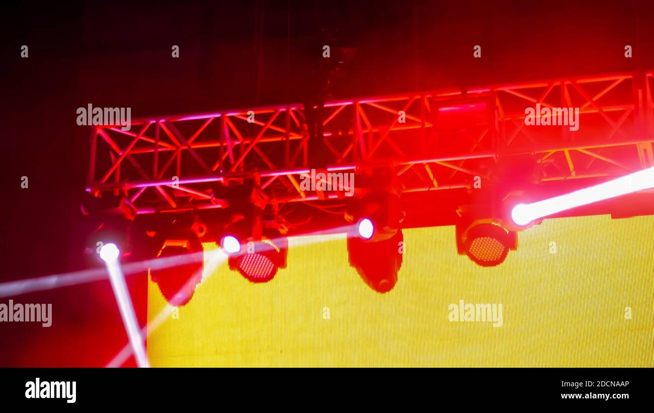 Colorful bright red concert lighting equipment for stage at nightclub ...