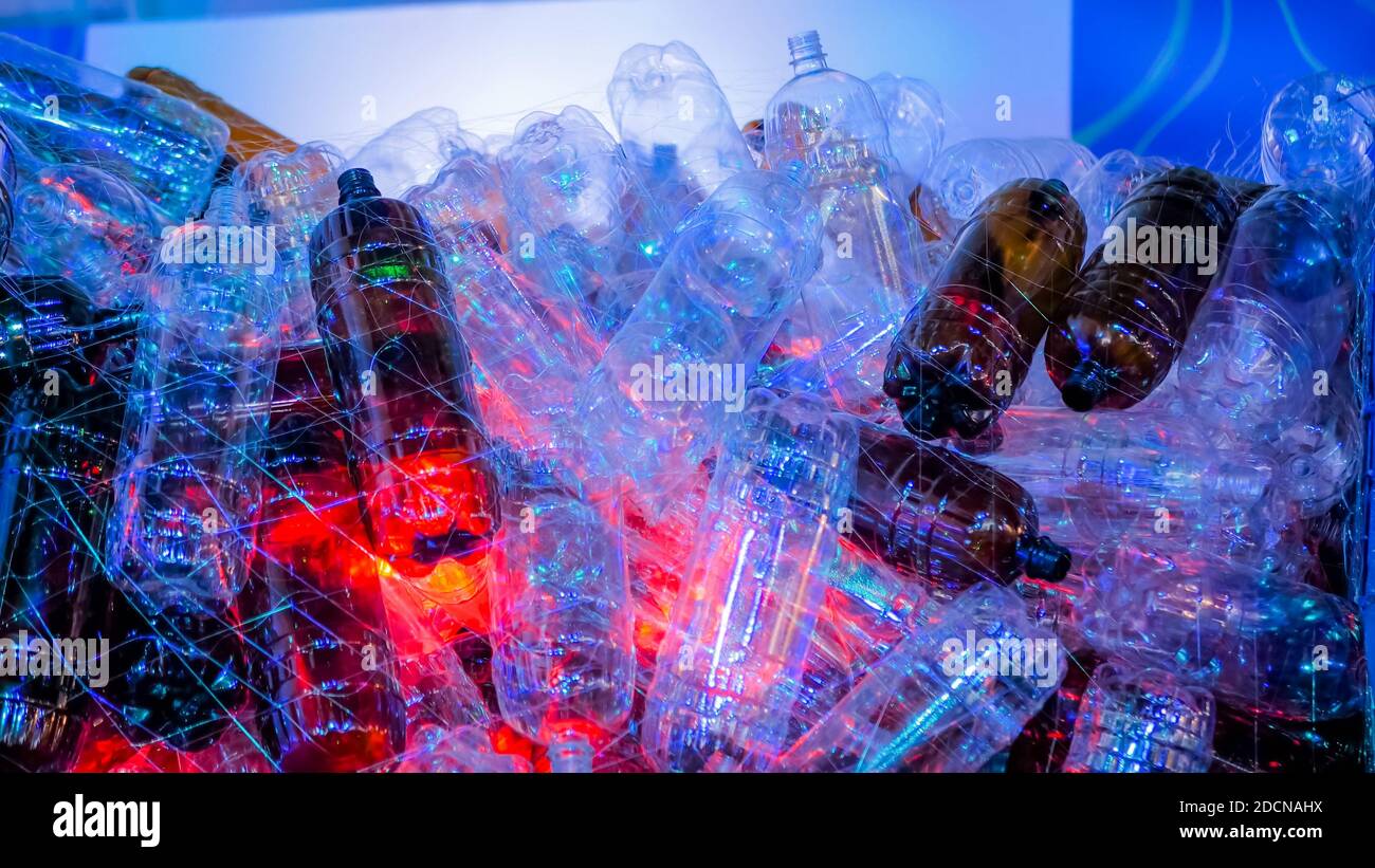 Ecology concept - plastic bottle installation with blue and red ...