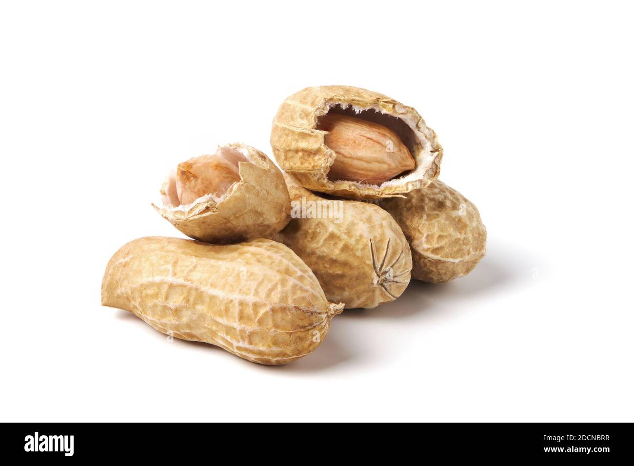 Raw peanuts isolated on white. Heap of groundnuts in a nutshell Stock ...