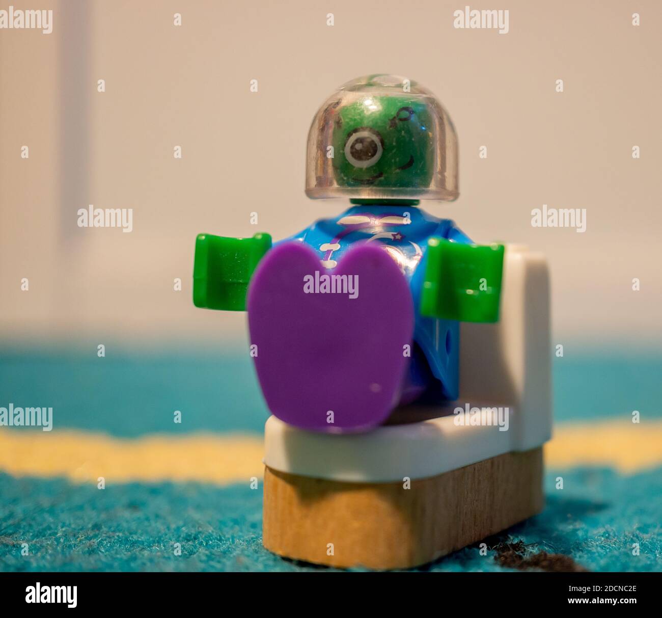 POZNAN, POLAND - Nov 20, 2020: Playtive alien figurine sitting on a ...