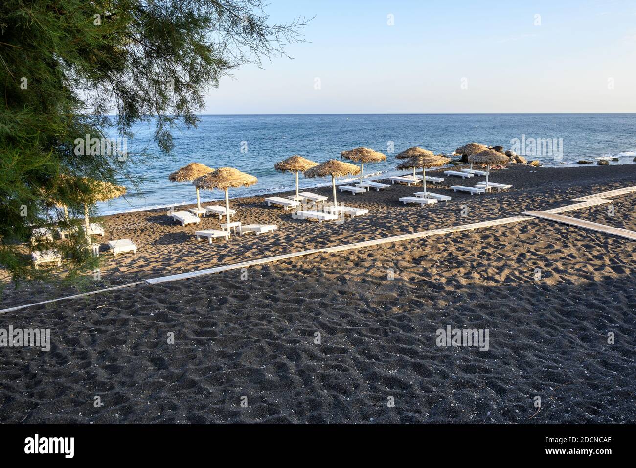 Black Beach with volcanic sand in Perissa, a tourist resort in ...
