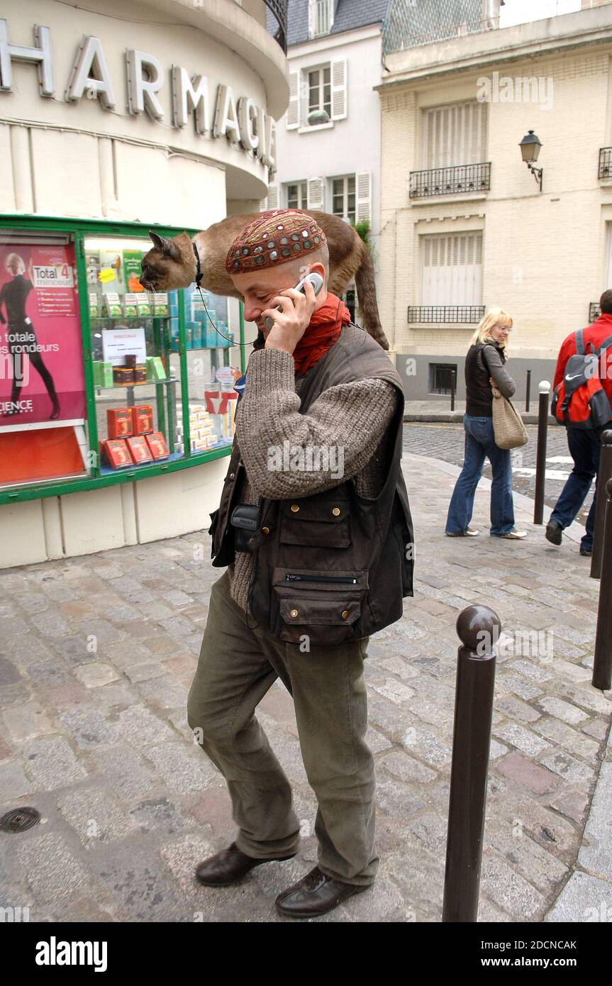 Man walking around with cat on his shoulder Montmartre in Paris, France ...