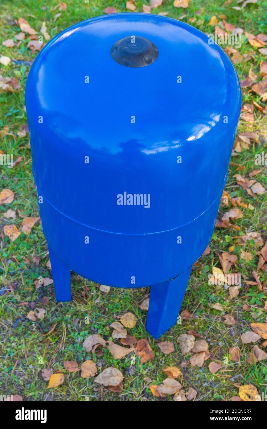 Blue metal water tank for 50 liters of water Stock Photo - Alamy