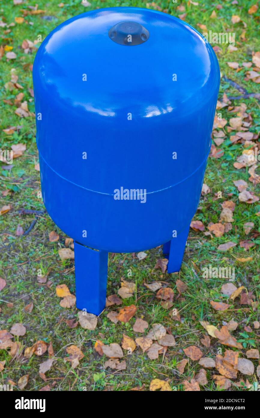 Blue metal water tank for 50 liters of water Stock Photo - Alamy