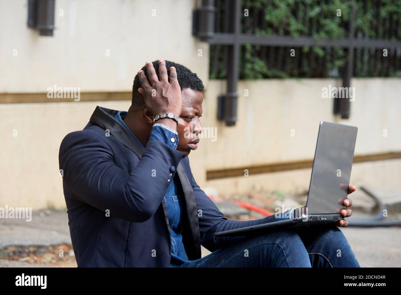 Angry, freaked businessman pulling his hair while screaming, looks bad ...