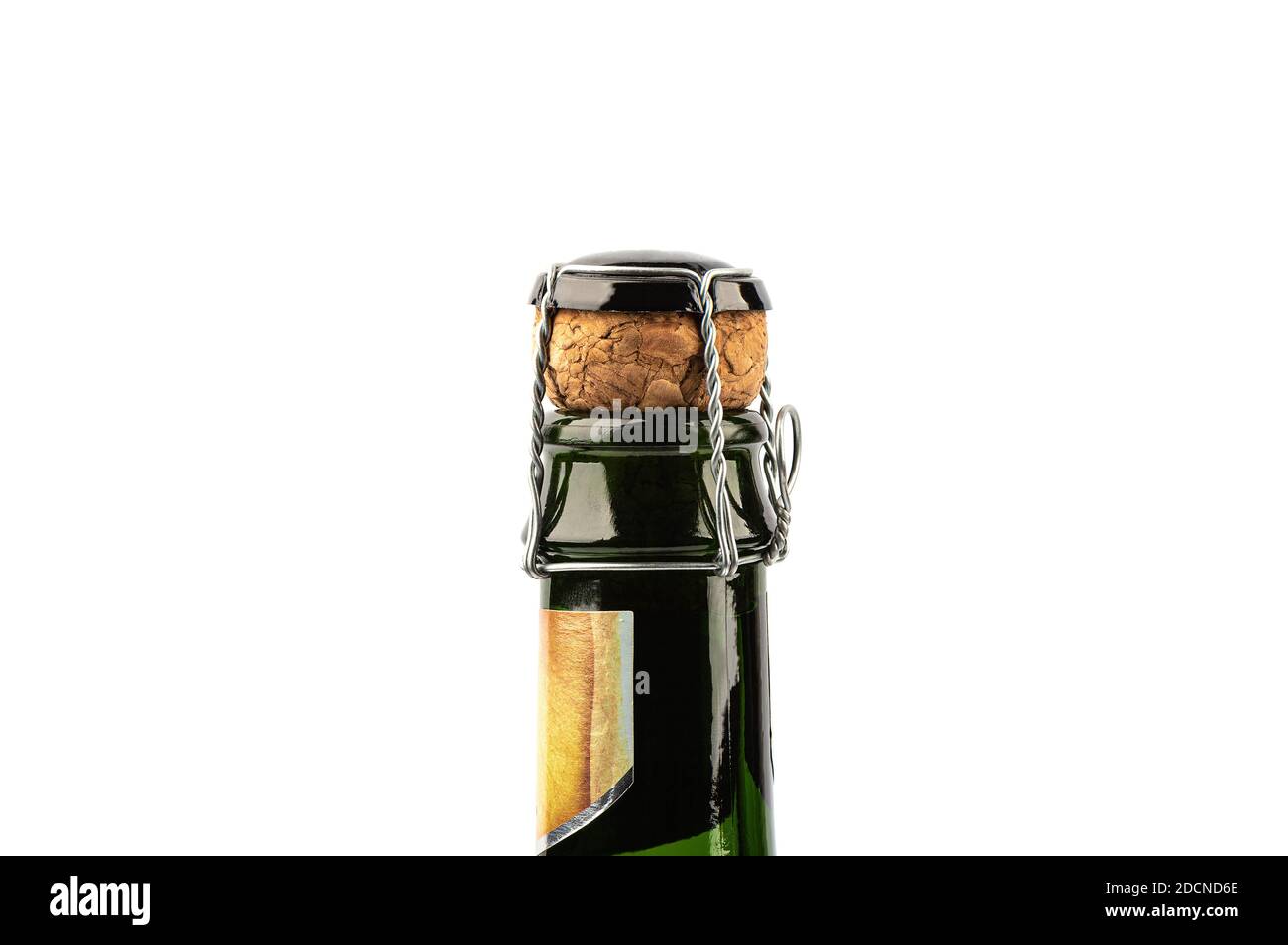 Close up of a bottle of champagne on a white background. Muselet is ...