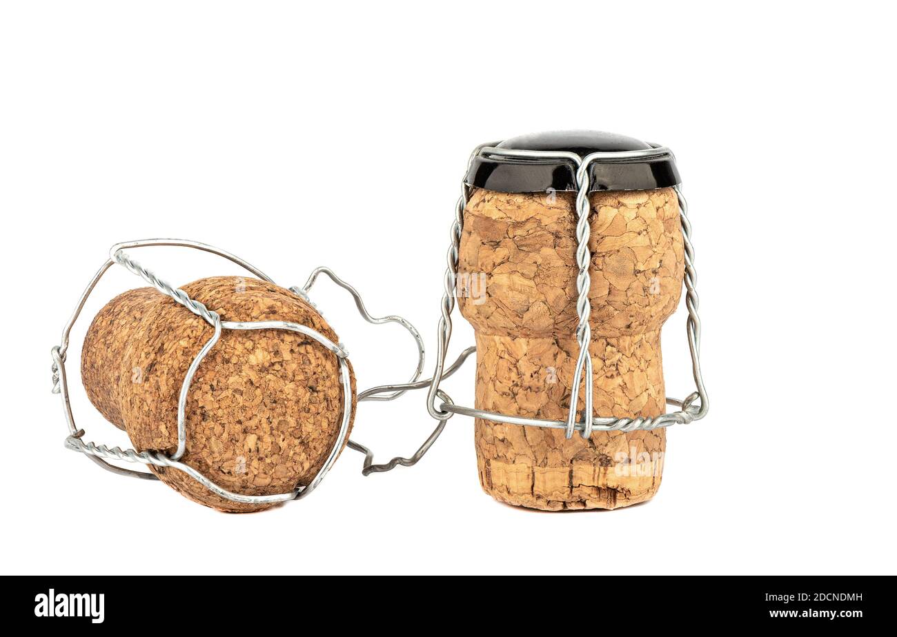 Two corks of champagne with muselet isolated on white background. Copy ...