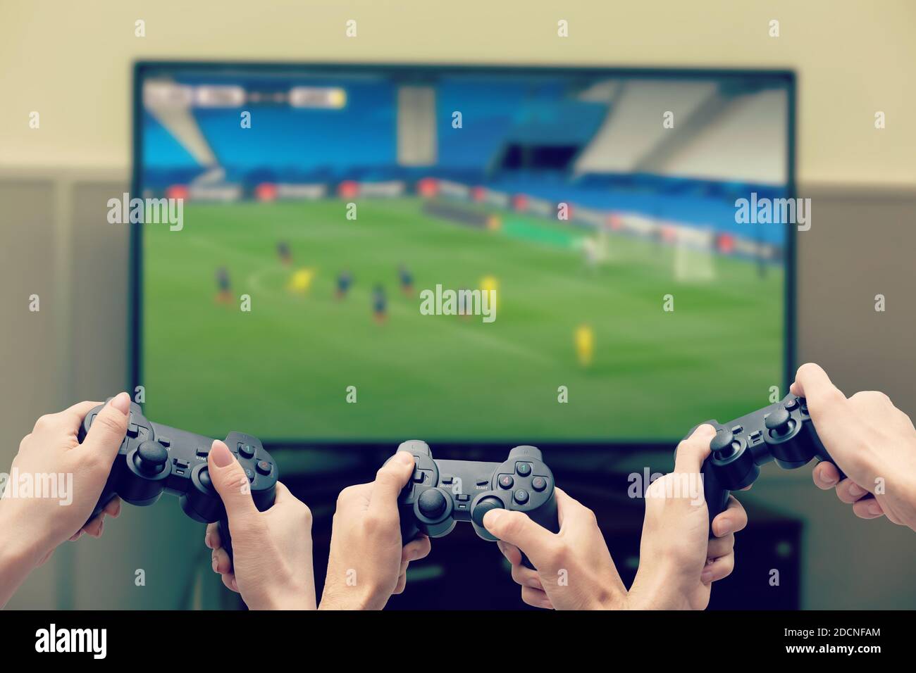 hands with joystick play football Stock Photo - Alamy