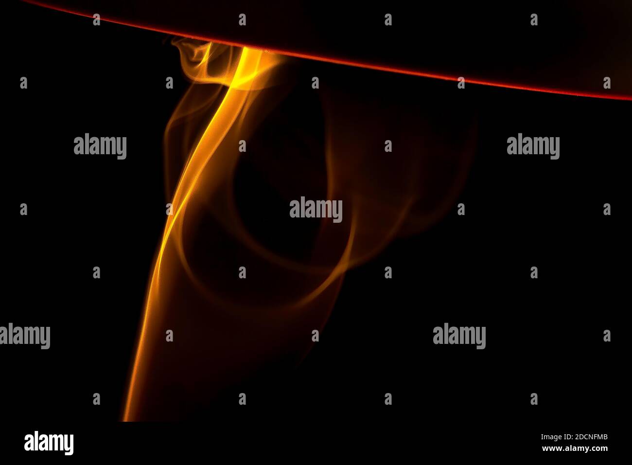 A close up picture of smoke under a light source Stock Photo - Alamy