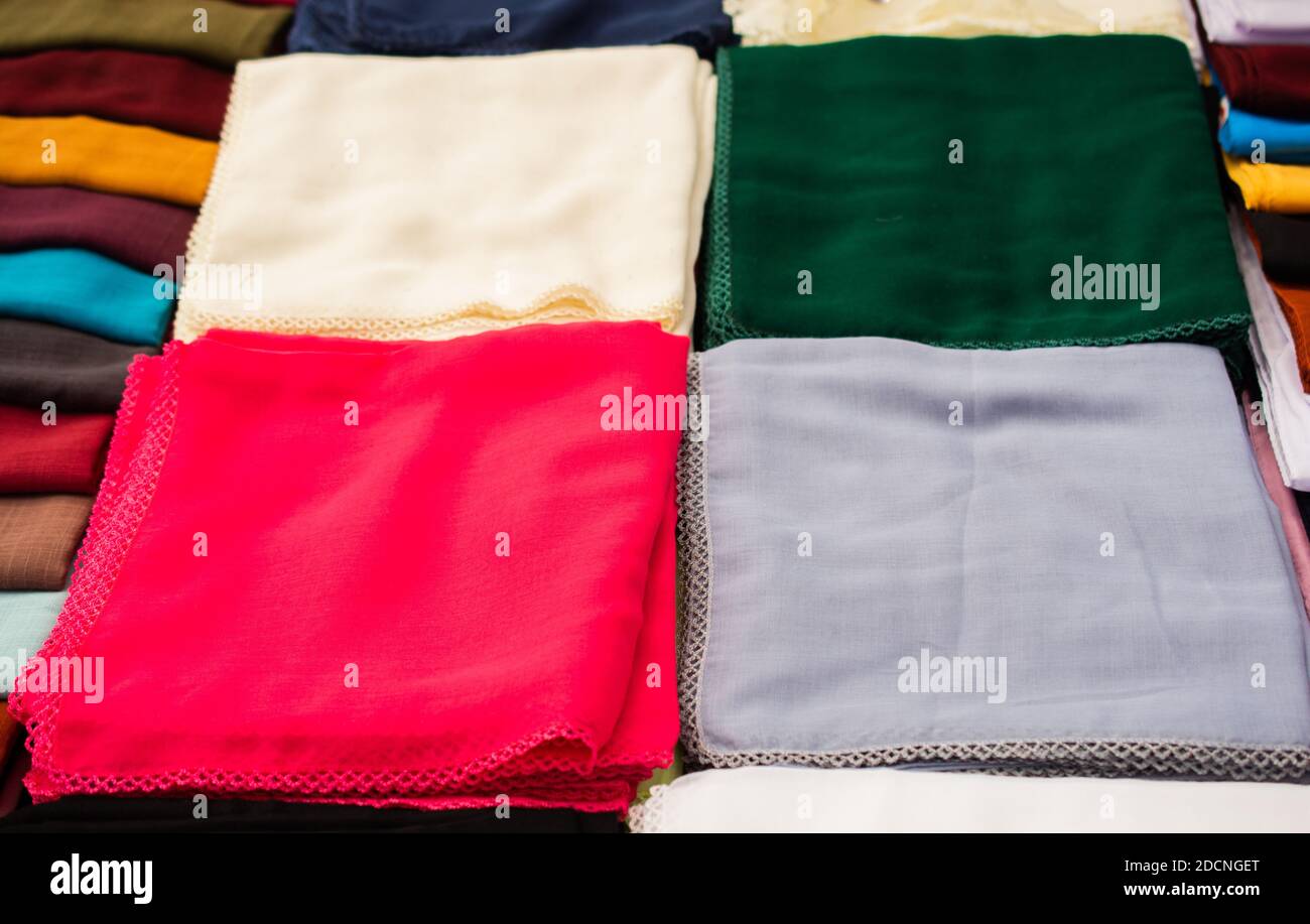 Pile of bright Multi-colored pieces of fabric in a bazaar Stock Photo ...