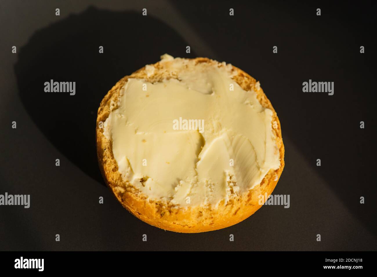 Buttered bread roll. Lovely and crusty, ready to eat. Bread with butter ...