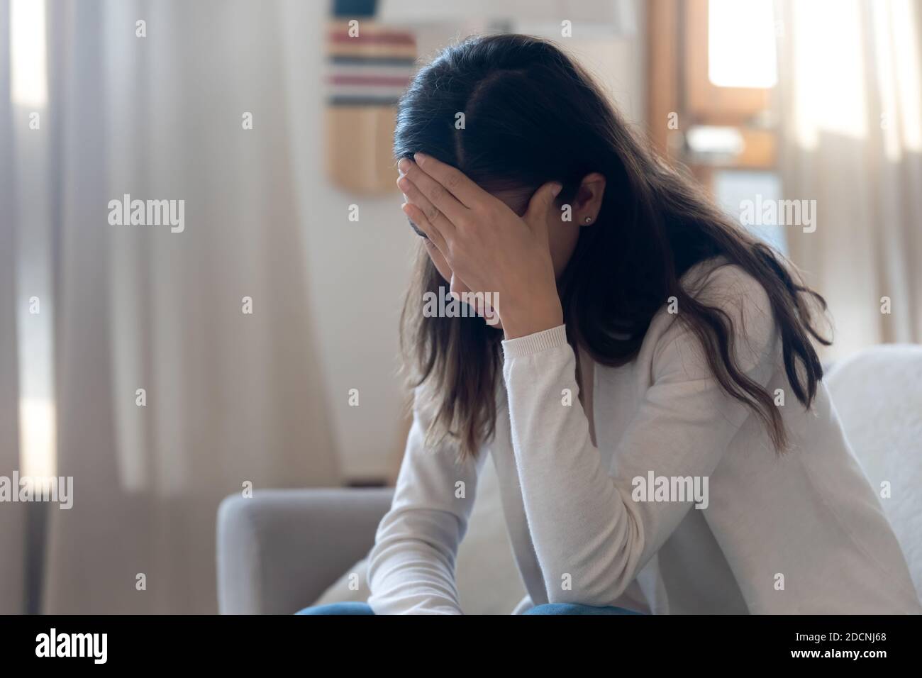 Covering face crying female hi-res stock photography and images - Alamy