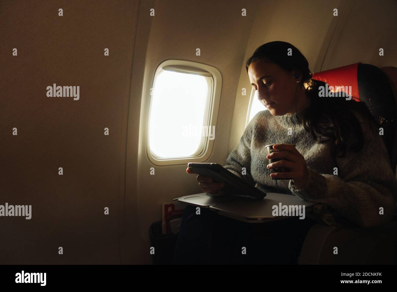 Businessman cell phone plane hi-res stock photography and images - Alamy