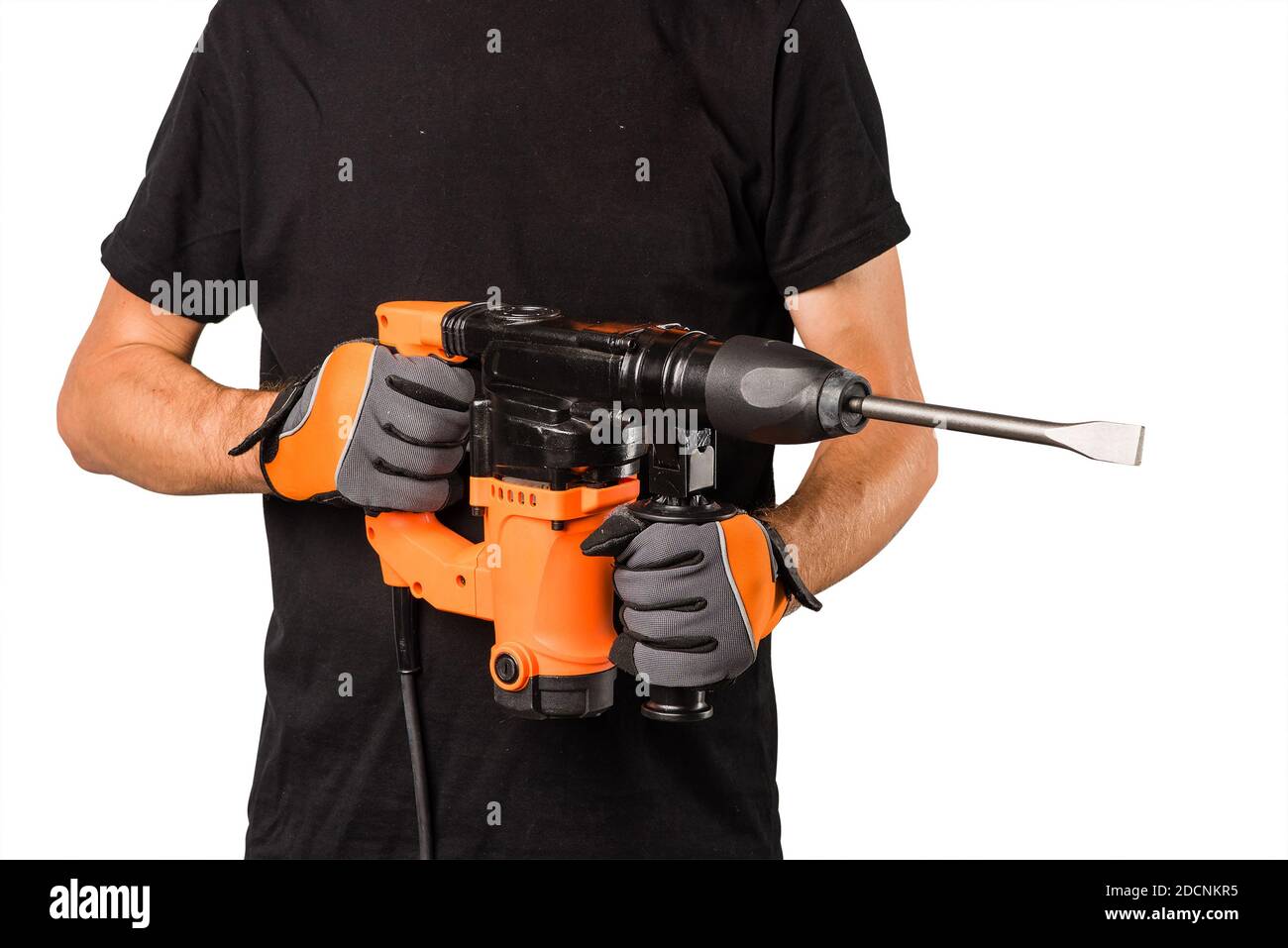 Male hands in protective gloves holding new big electric perforator ...