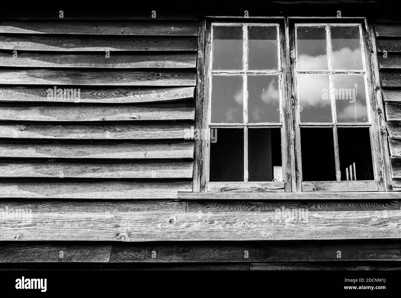 Timber cladded building in state of decay Stock Photo - Alamy