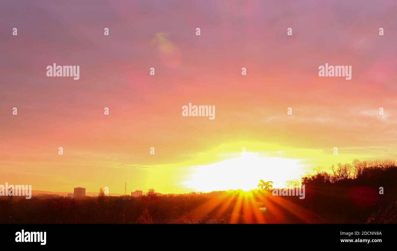 Amazing sunrise in rural scene. Dramatic sky with sunbeam and stratus ...
