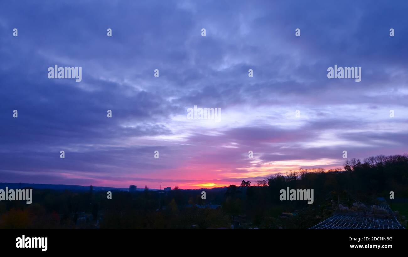 Amazing sunrise in rural scene. Dramatic sky with sunbeam and stratus ...