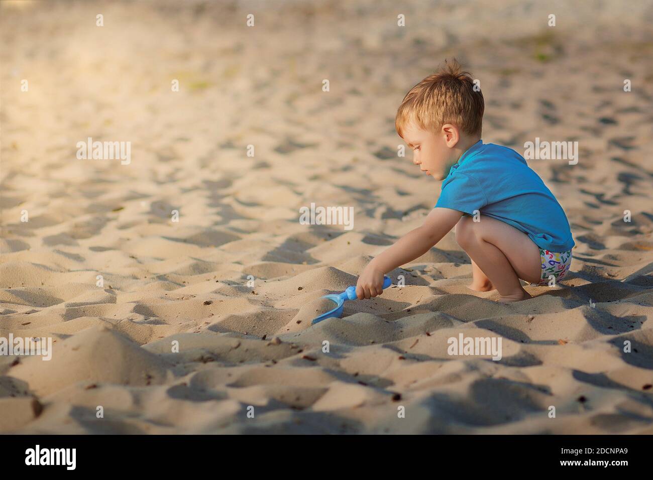 Boy playing on beach. Child play at sea on summer family vacation. Sand ...