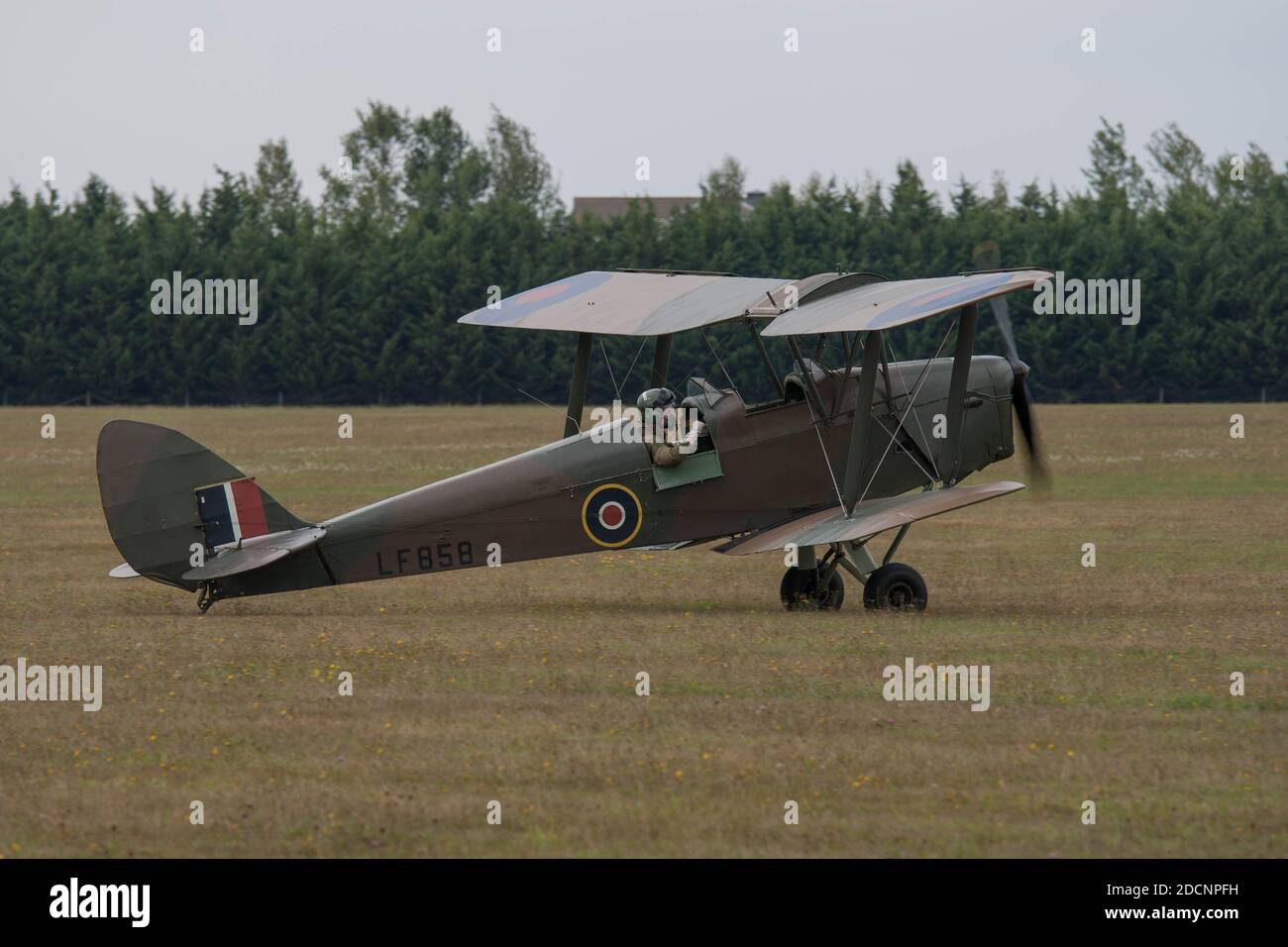 A single engine Gypsy Moth biplane aircraft taxiing at White Waltham ...