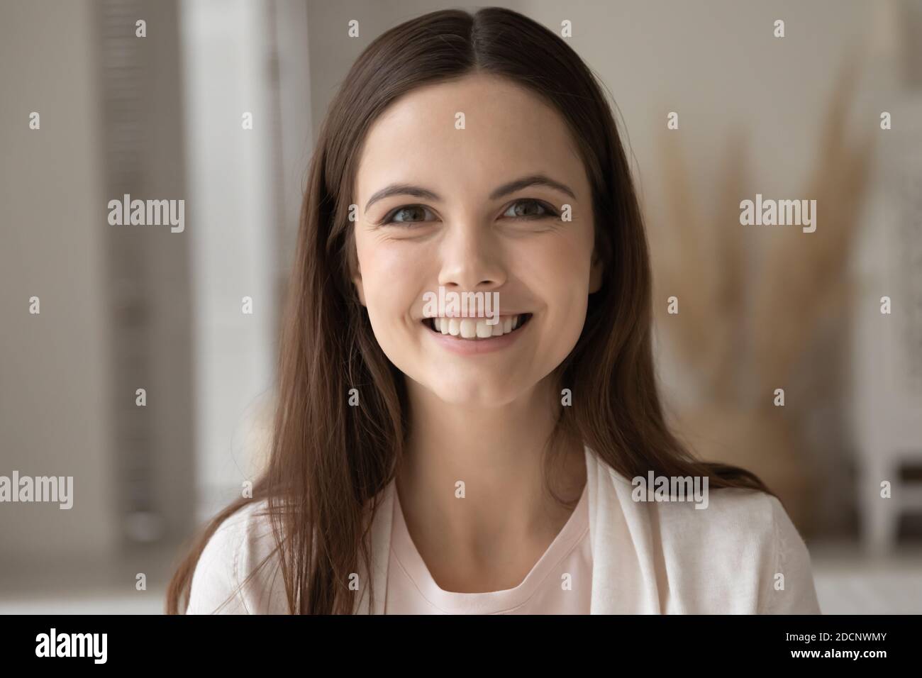 Profile picture of pretty smiling young woman posing indoors Stock ...