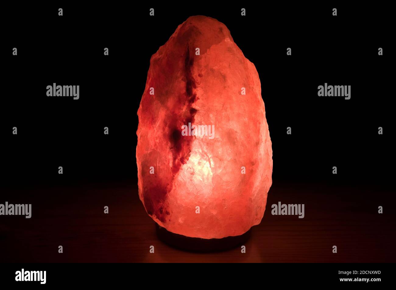 Himalayan Salt Lamp on black background horizontally Stock Photo - Alamy