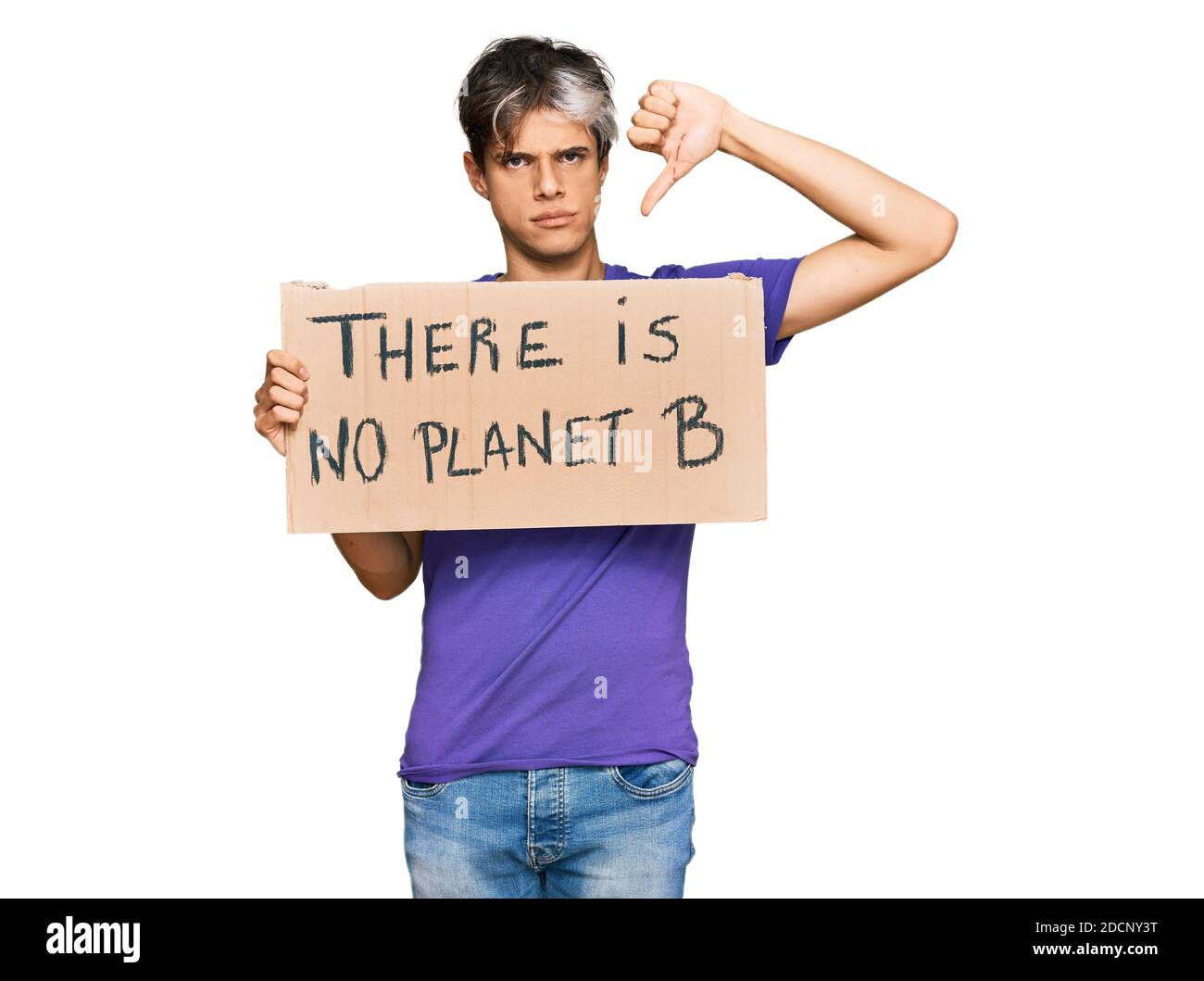 Young hispanic man holding there is no planet b banner with angry face ...