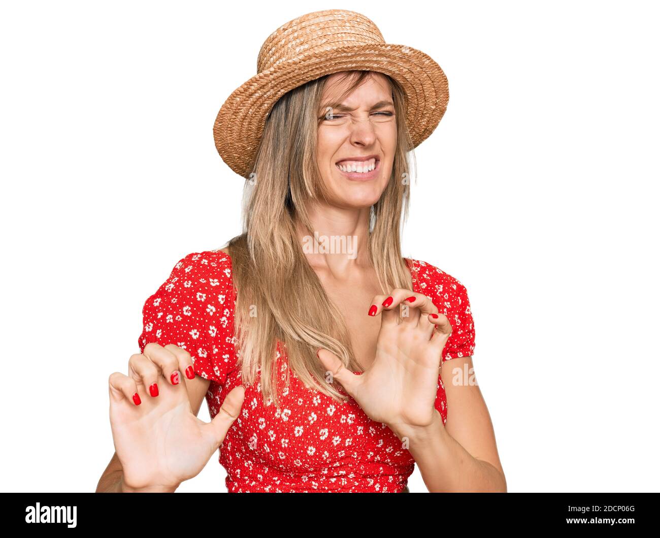 Beautiful caucasian woman wearing summer hat disgusted expression ...
