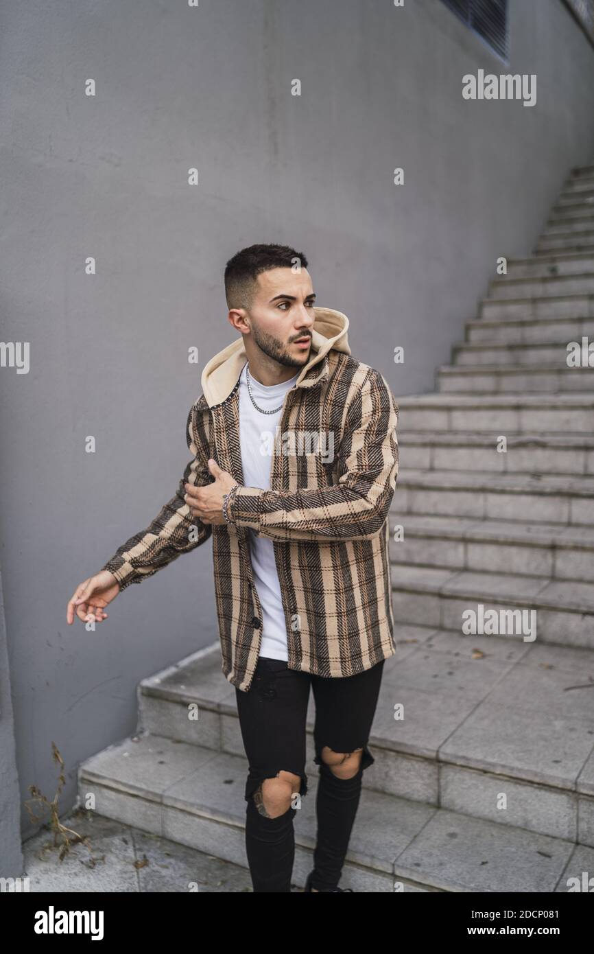 Man coming down a staircase hi-res stock photography and images - Alamy