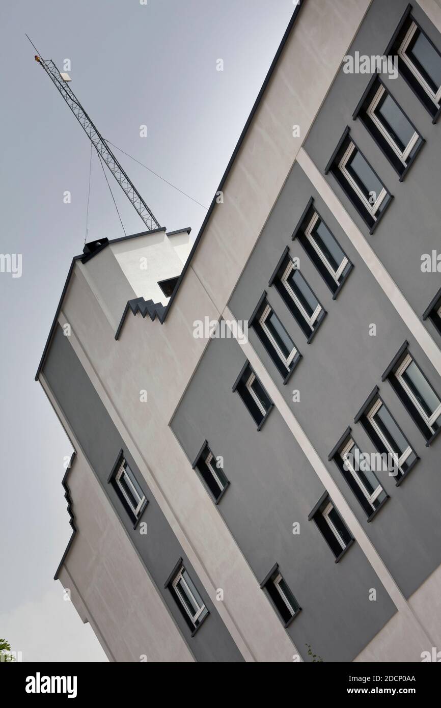 Building facade with square windows and sky Stock Photo - Alamy