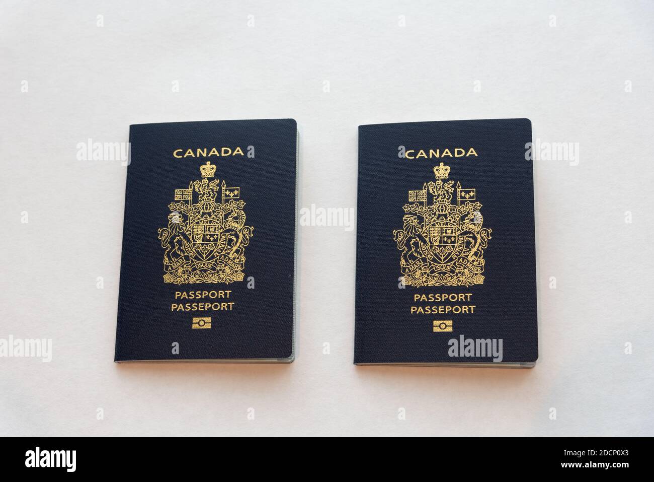 Canadian passports isolated on white background Stock Photo - Alamy