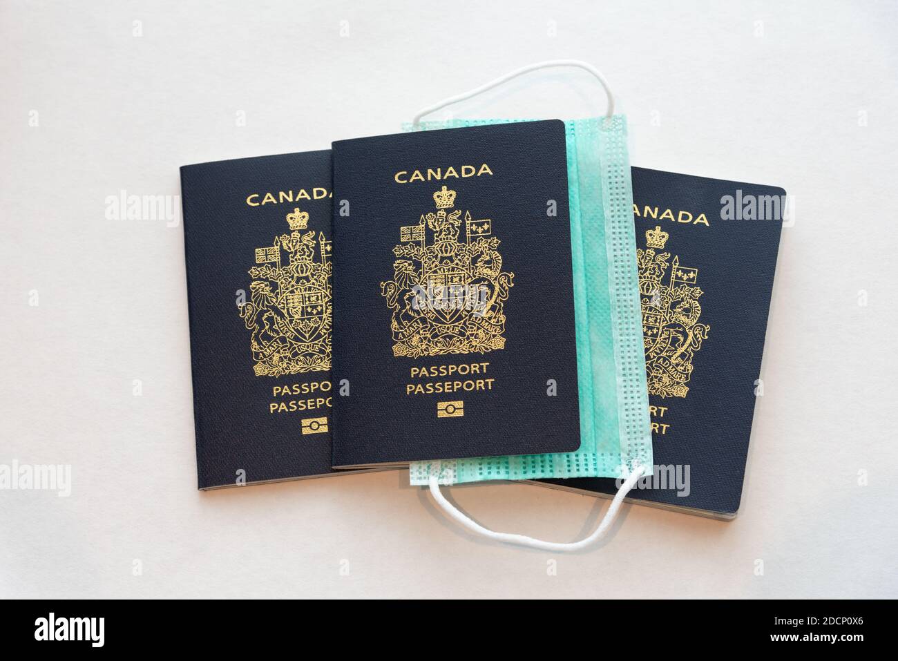 Canadian passports with Covid-19 mask Stock Photo - Alamy