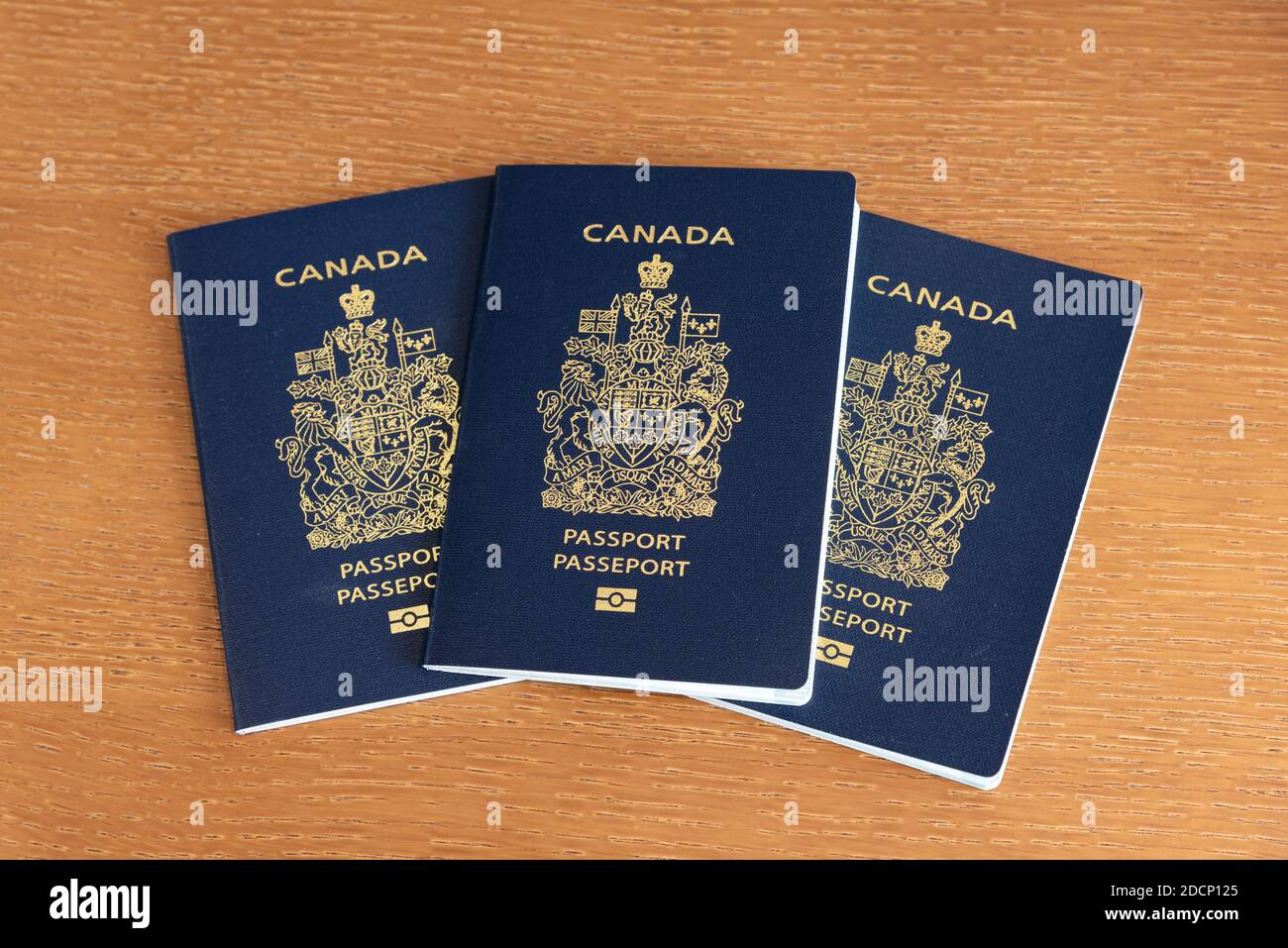 Canadian passports isolated on white background Stock Photo - Alamy
