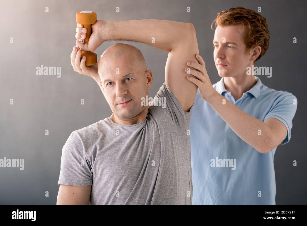 Handsome men exercising in gym hi-res stock photography and images - Alamy