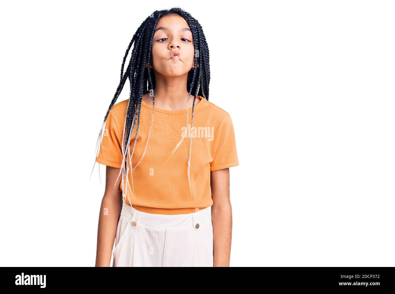 Cute african american girl wearing casual clothes making fish face with ...